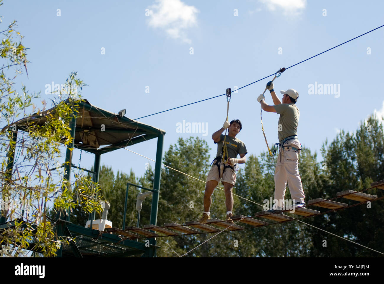people walk hanging on a rope Stock Photo - Alamy