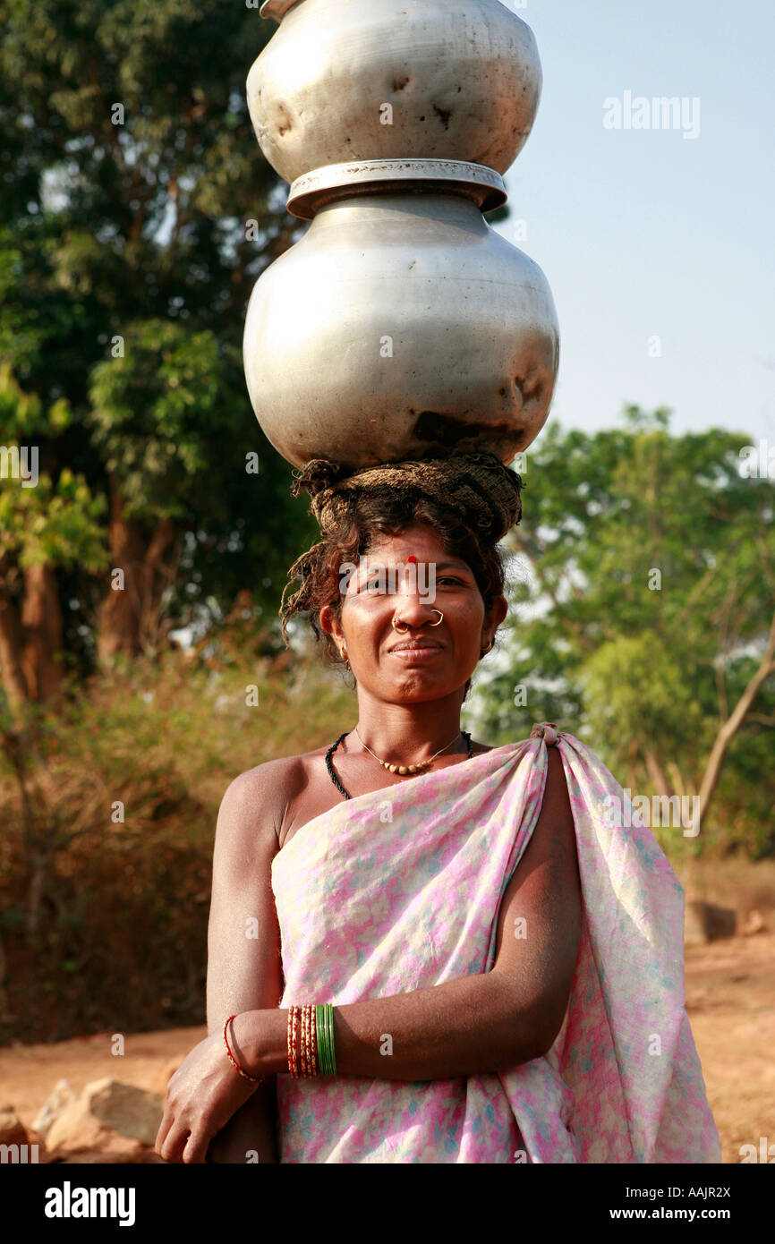 Rural woman carrying water pots hi-res stock photography and images - Alamy