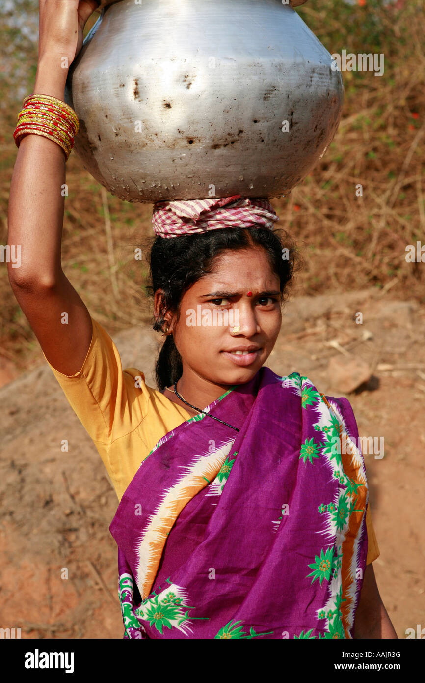 Woman carrying pots at a pool near Jeypore, Orissa, India Stock Photo ...