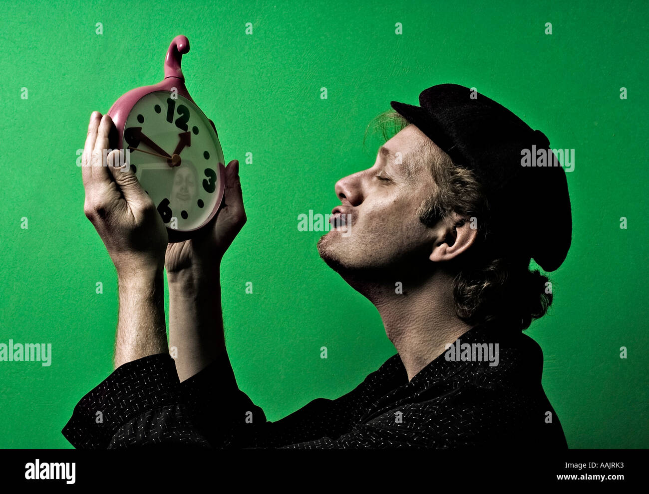 man holding big watch Stock Photo - Alamy