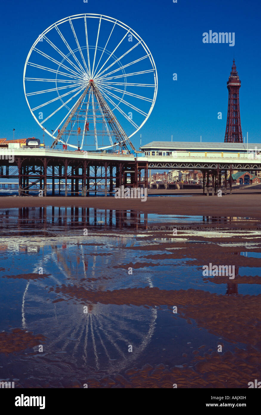 blackpool beach tower and ferris wheel on pier reflections lancashire ...