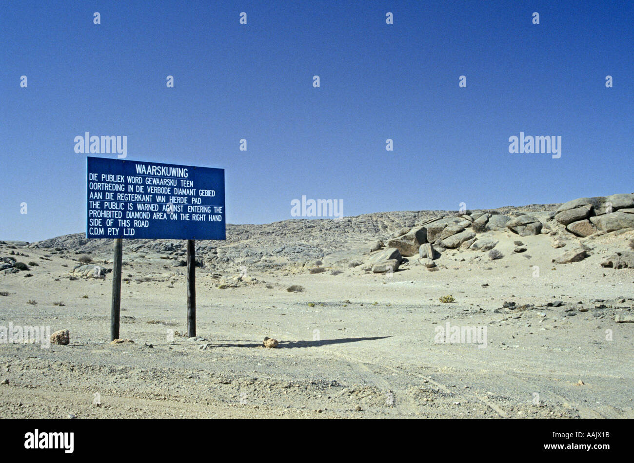 Roadside sign warning against access to the diamond mining area near ...