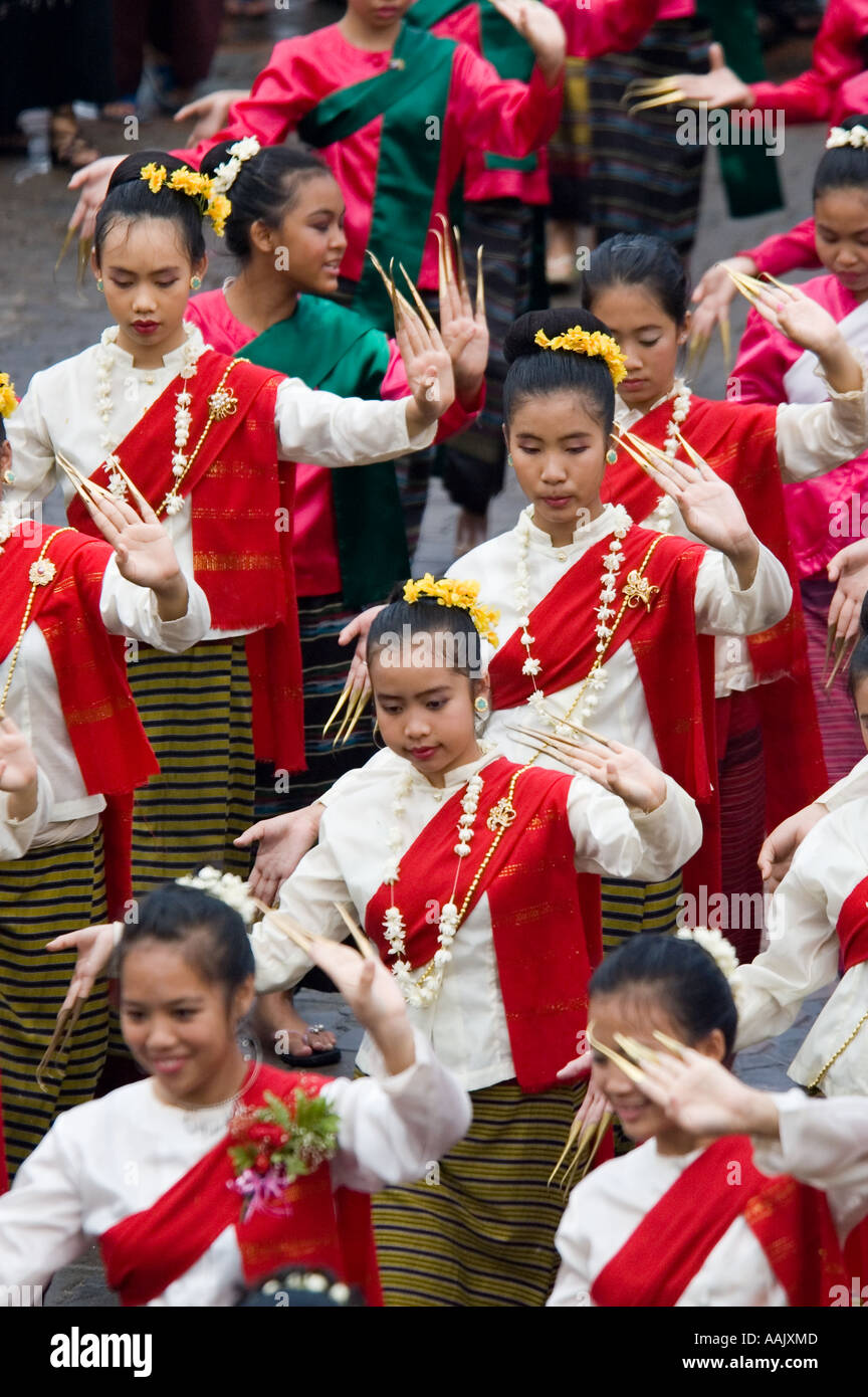 Woman perform a fawn dance in a procession during the Songkran New Year ...