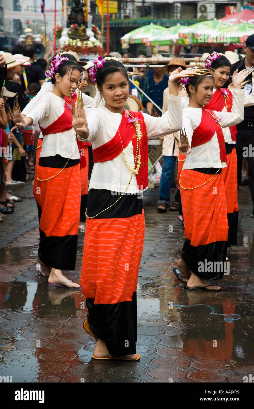 Woman perform a fawn dance in a procession during the Songkran New Year ...