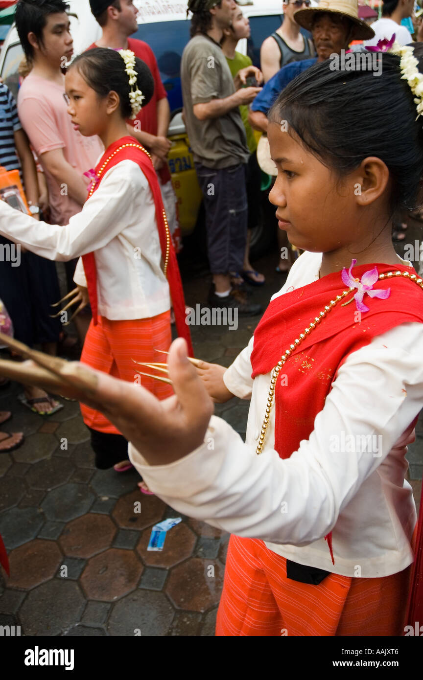 Woman perform a fawn dance in a procession during the Songkran New Year ...