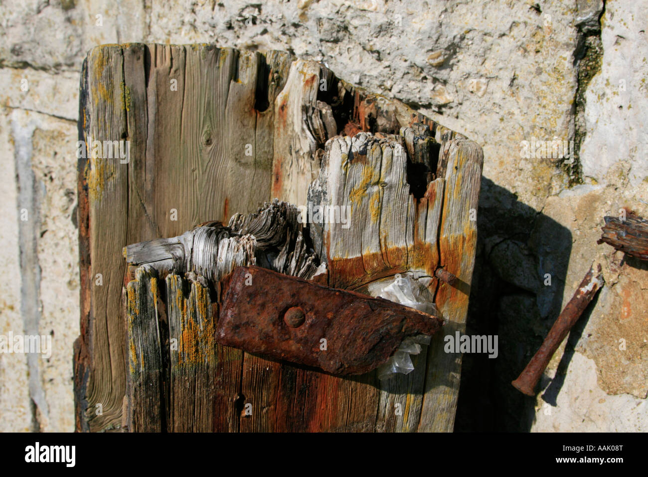old splintered timber post the cobb lyme regis view towards town dorset ...