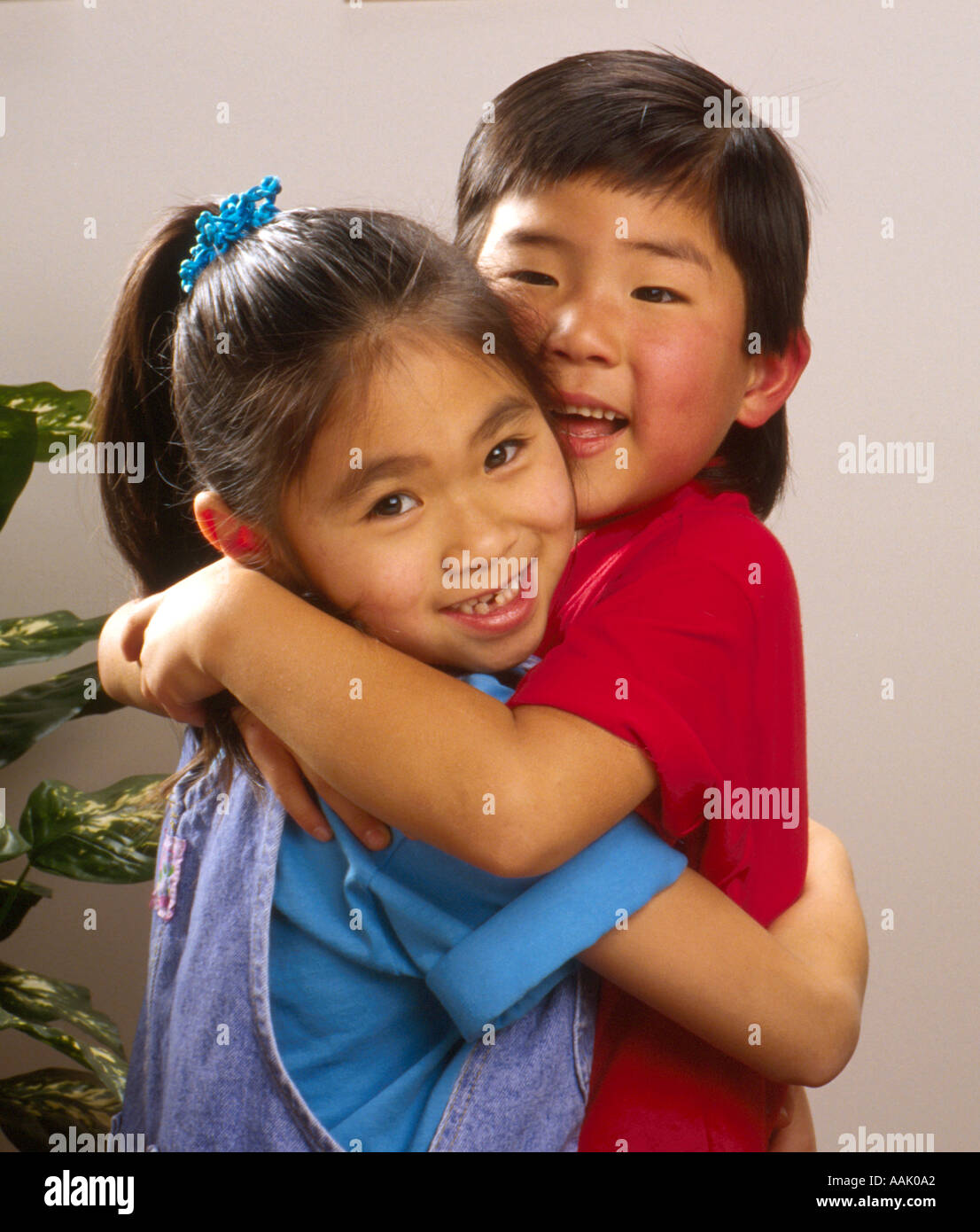 Brother and sister hugging Stock Photo - Alamy