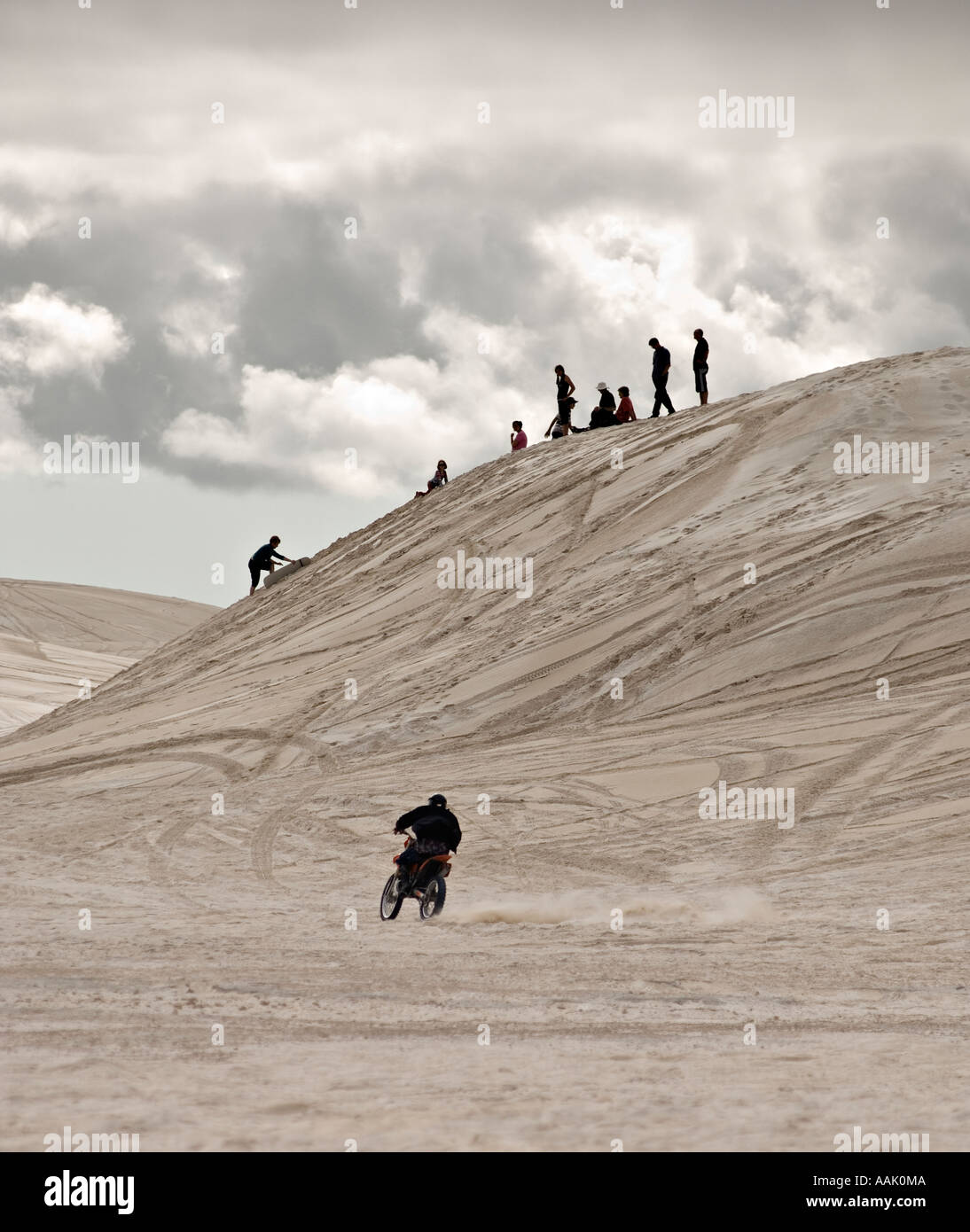 motorbike racing on sand dunes Stock Photo - Alamy