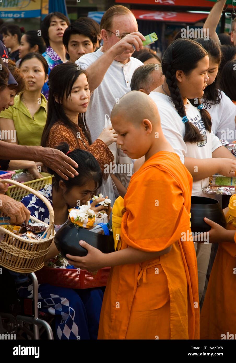 Buddhist monks participate in morning merit making ceremonies during ...