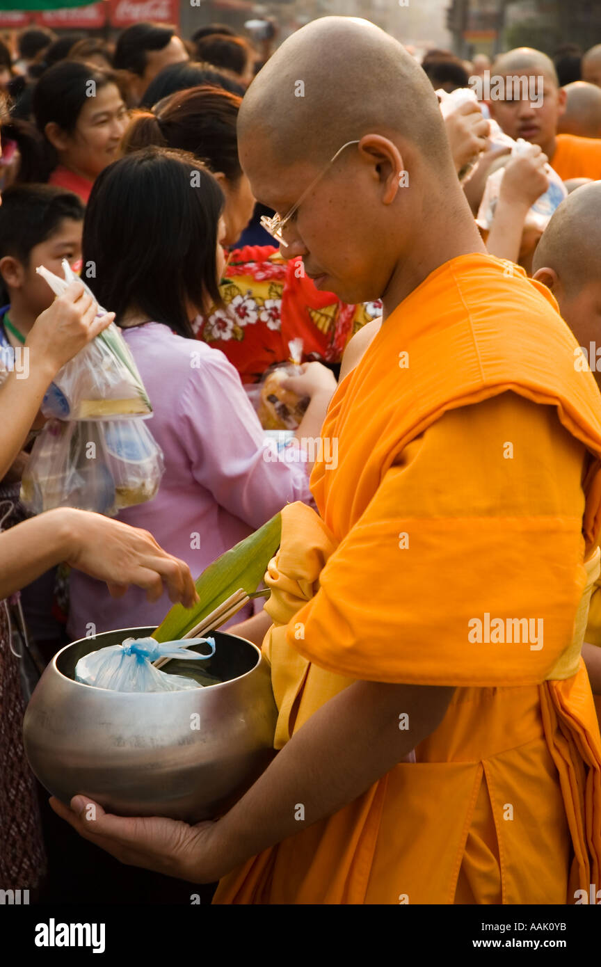 Buddhist monks participate in morning merit making ceremonies during ...