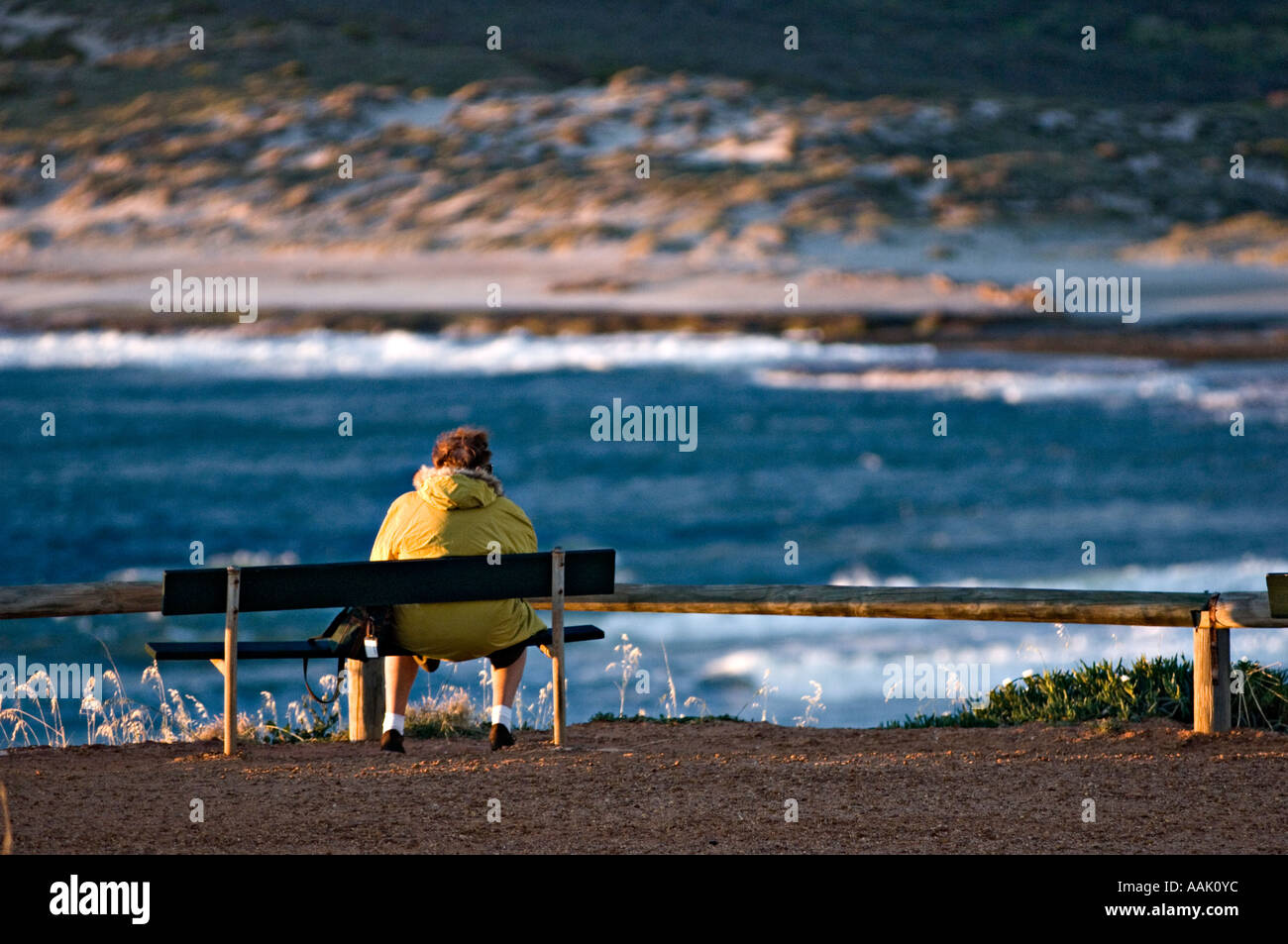 woman sitting on bench on seafront in kalbarri Stock Photo - Alamy
