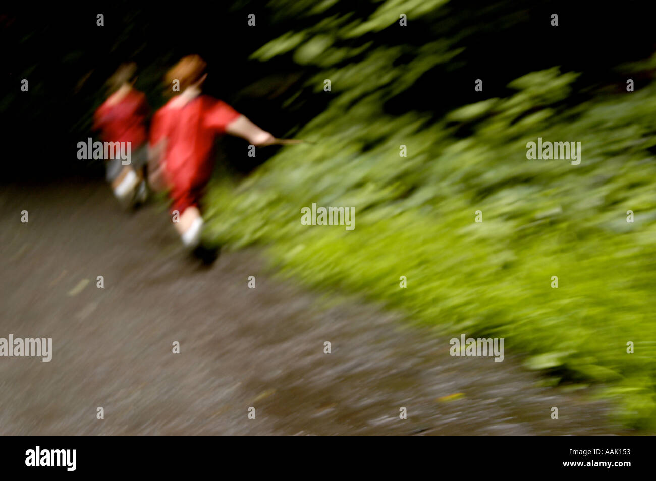 Children running on forest path Stock Photo - Alamy
