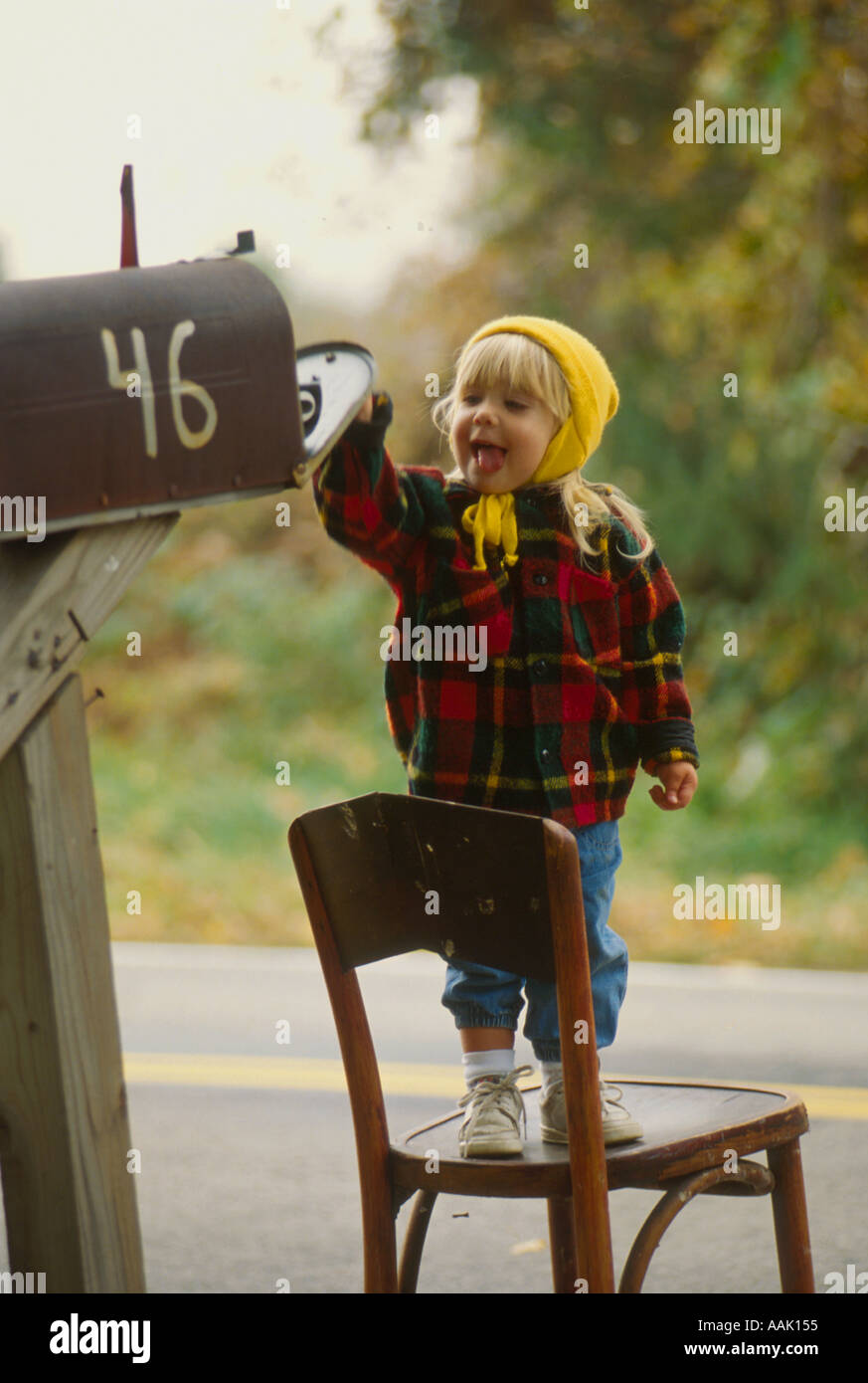 Little girl getting mail Stock Photo - Alamy