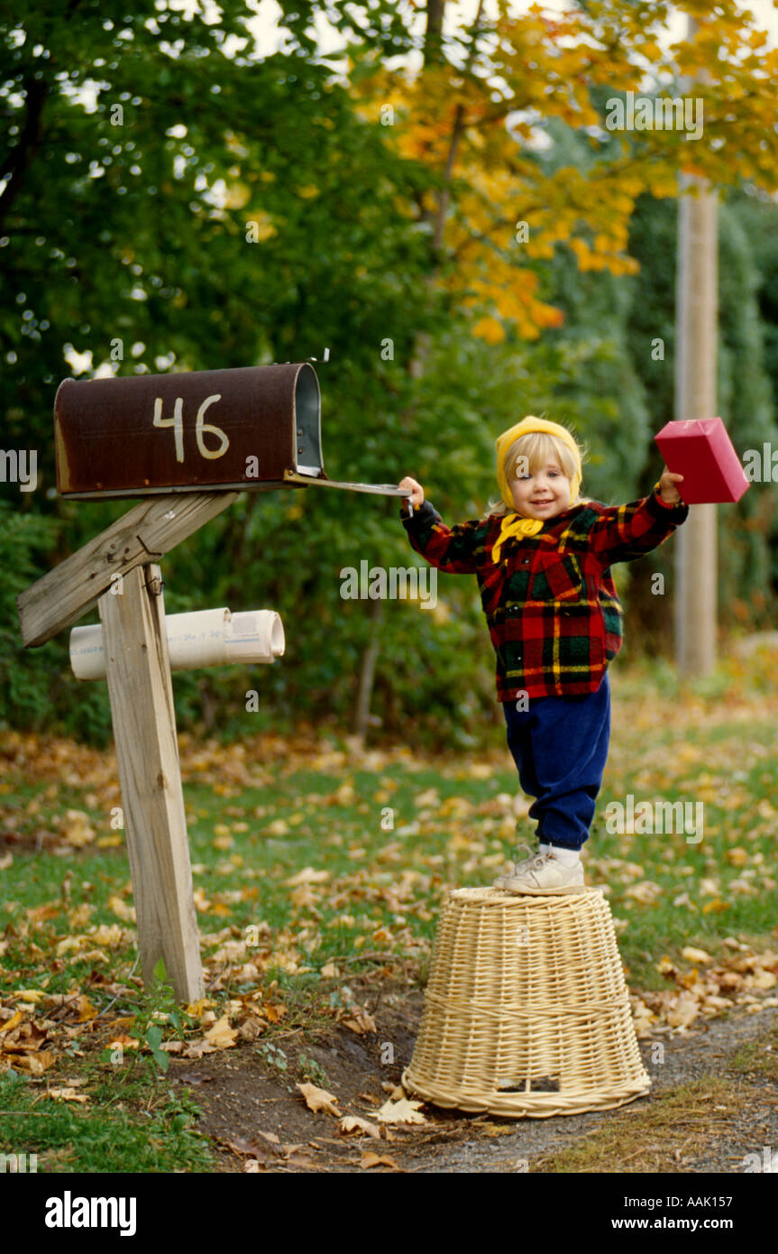Little girl getting mail Stock Photo - Alamy