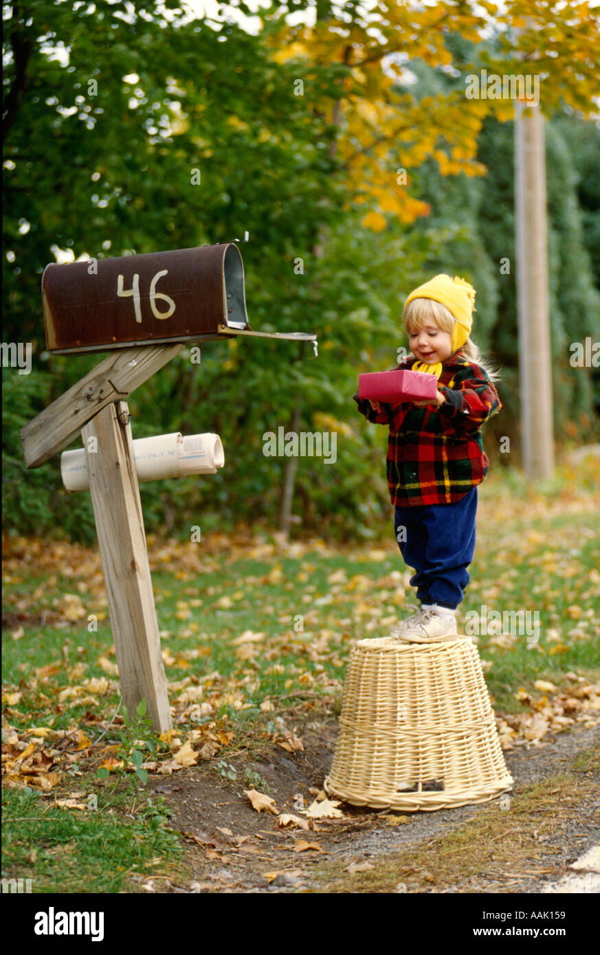 Little girl getting mail Stock Photo - Alamy