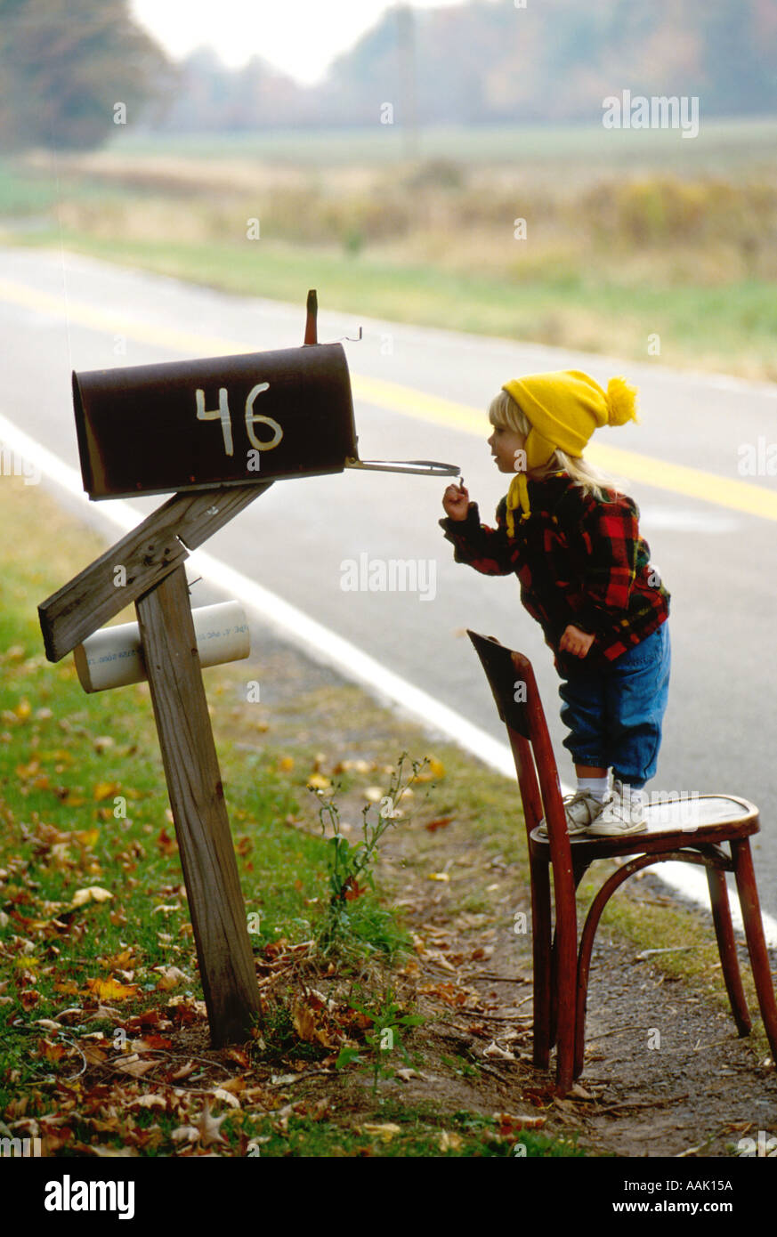 Little girl getting mail Stock Photo - Alamy