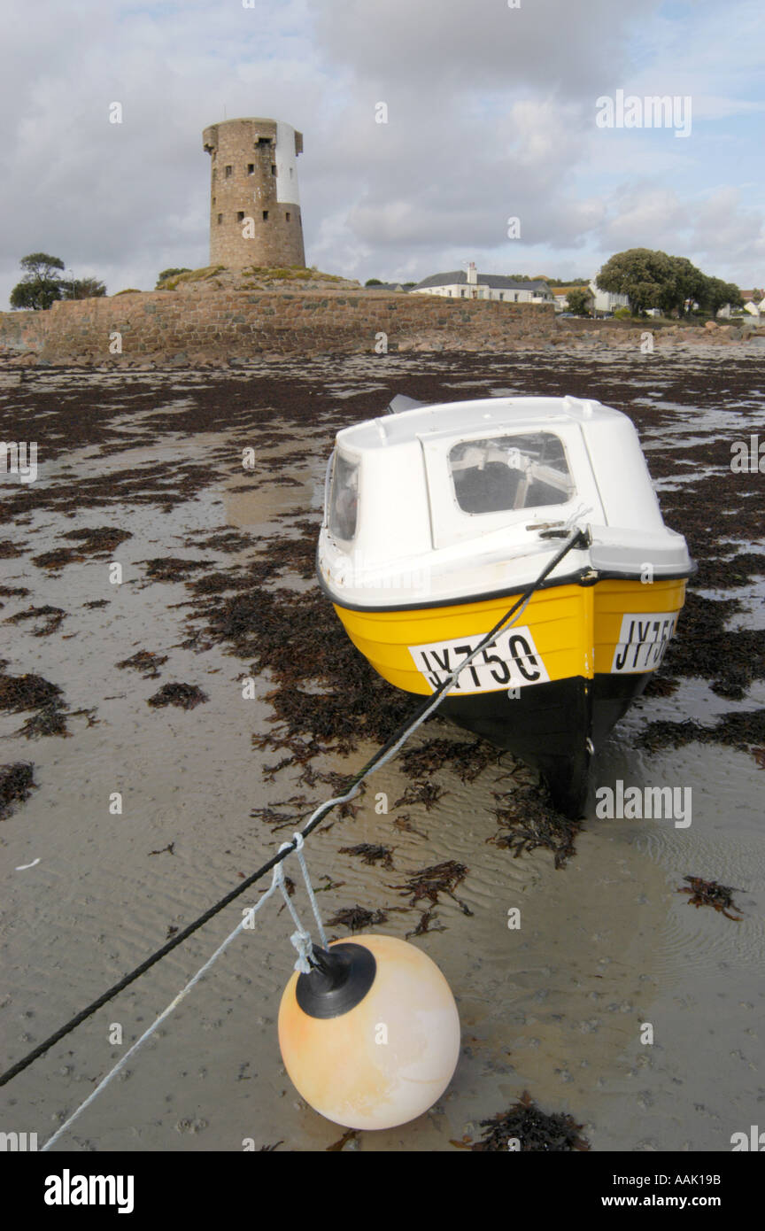 Beached boat on beach in front of WWII watchtower at St Clements bay in ...