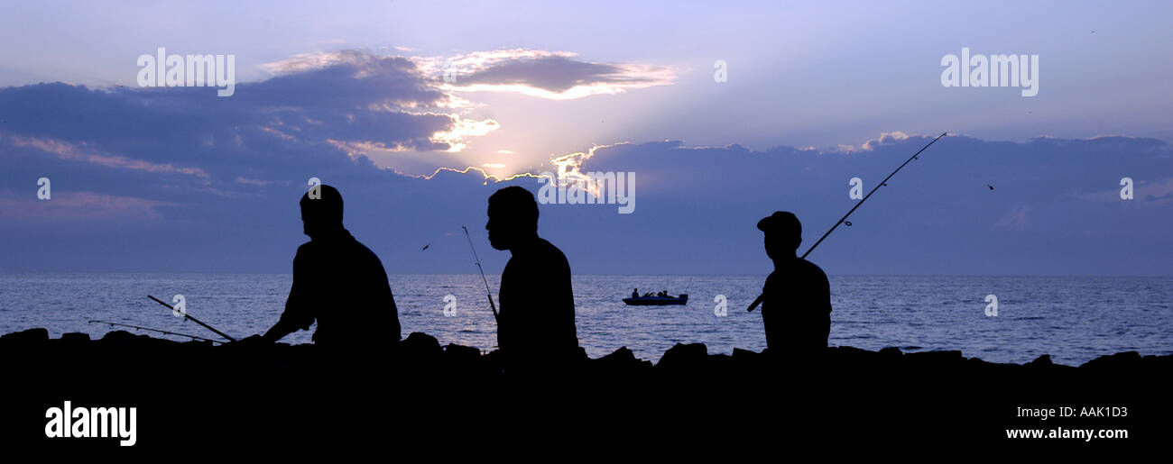 Three fishermen Stock Photo - Alamy