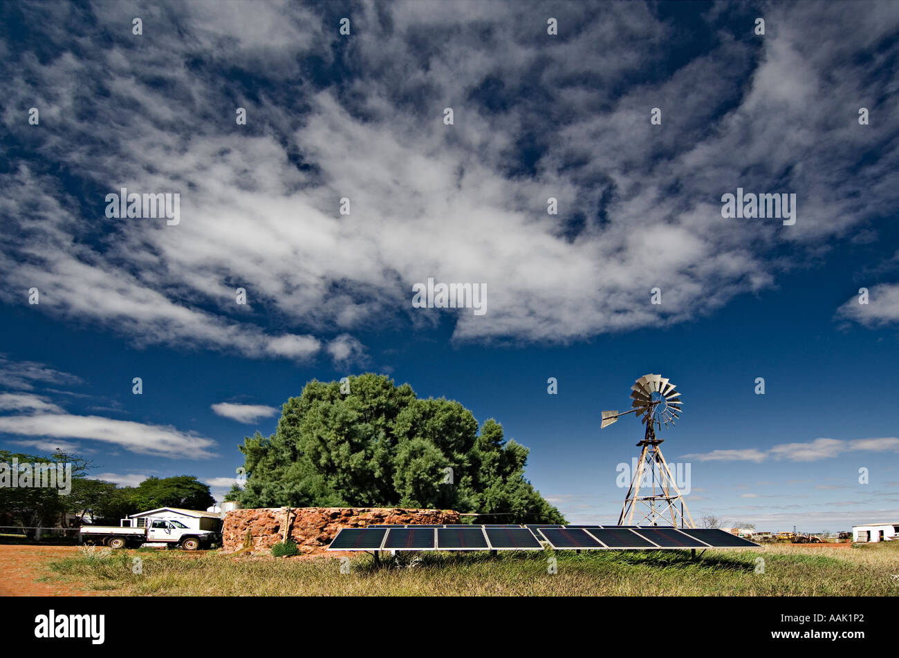 sun panels and windmill in outback farm Stock Photo - Alamy