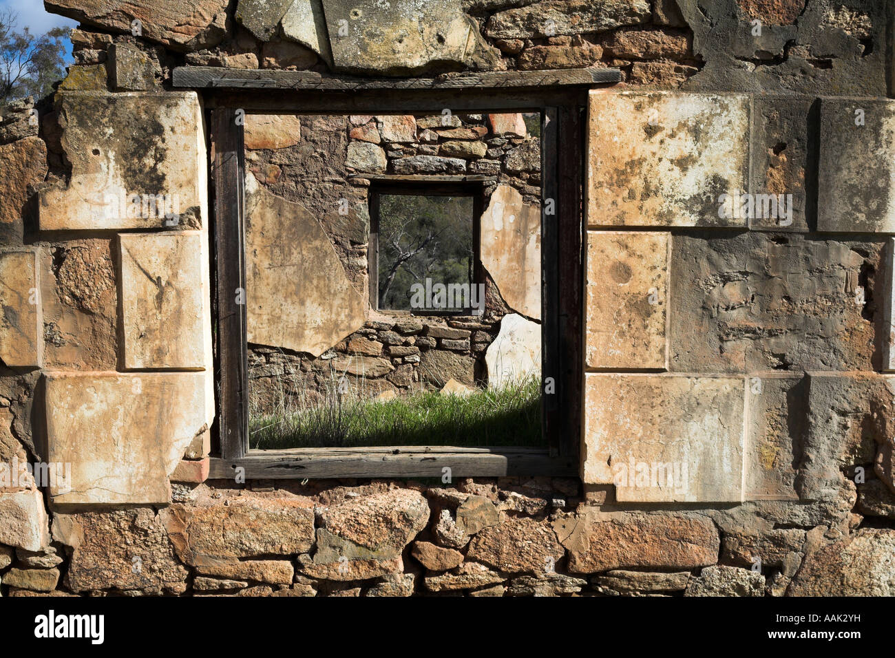view through window frames on ruins of a derelict colonial homestead in ...