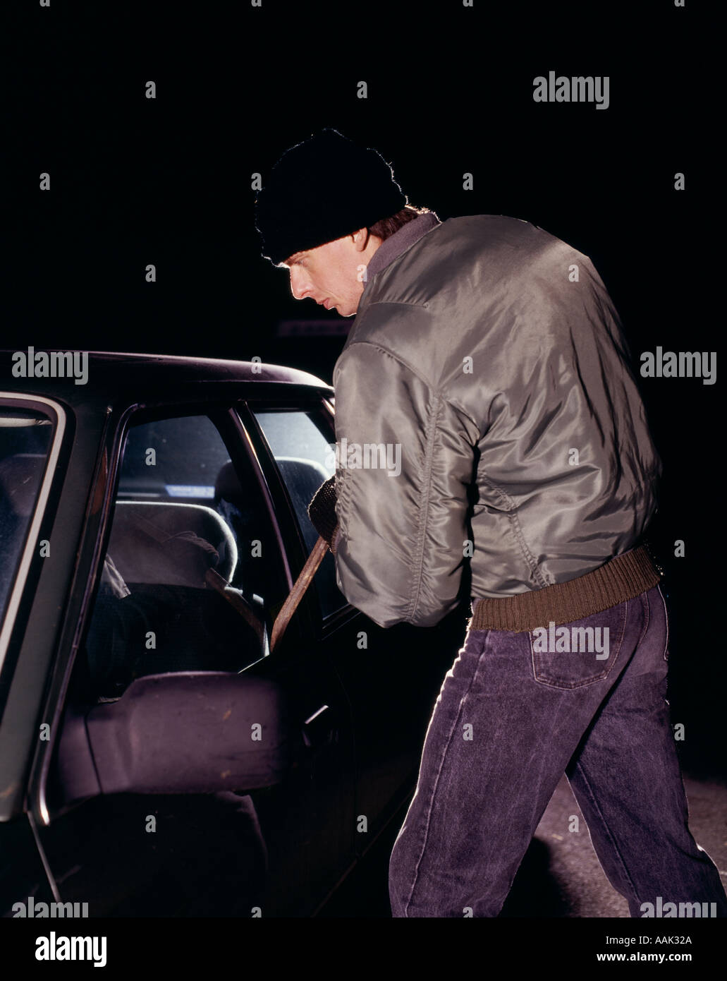 A car thief breaking into a car hi-res stock photography and images - Alamy