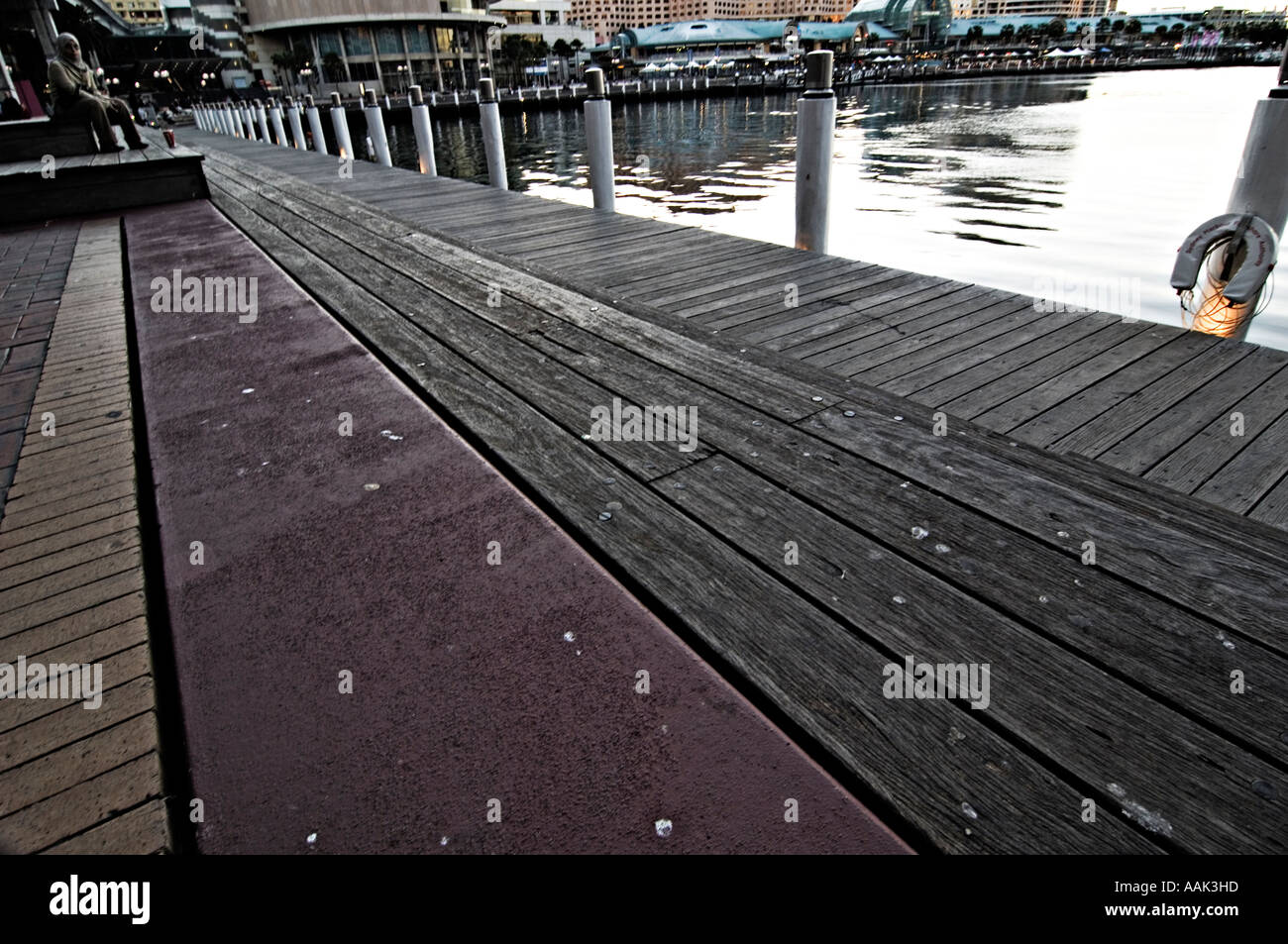 sunset on darling harbour teak pier Stock Photo - Alamy