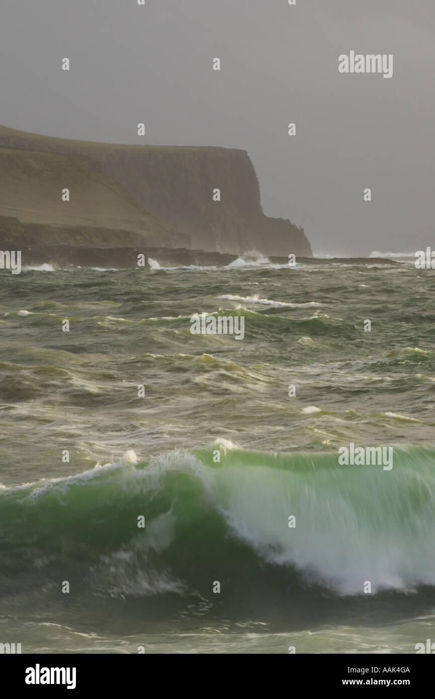 One wave breaking near the cliffs of moher hi-res stock photography and ...