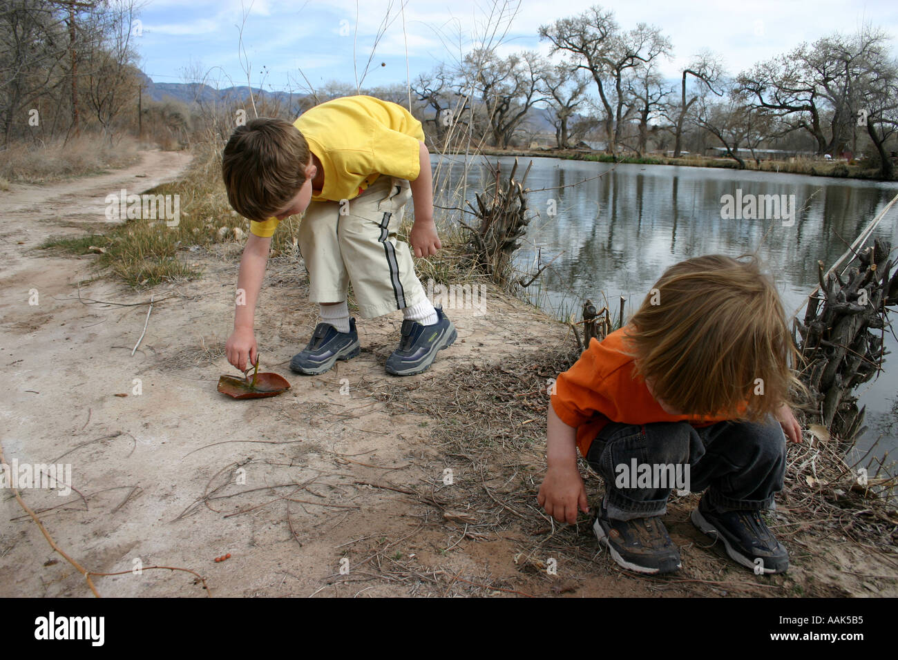 two boys by the pond Stock Photo - Alamy
