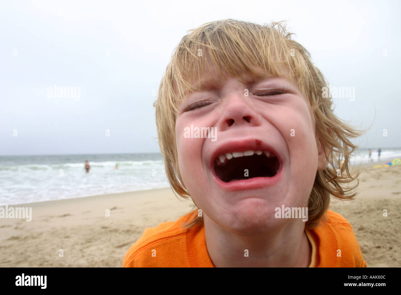 Three year old boy crying at the beach Stock Photo: 2340363 - Alamy