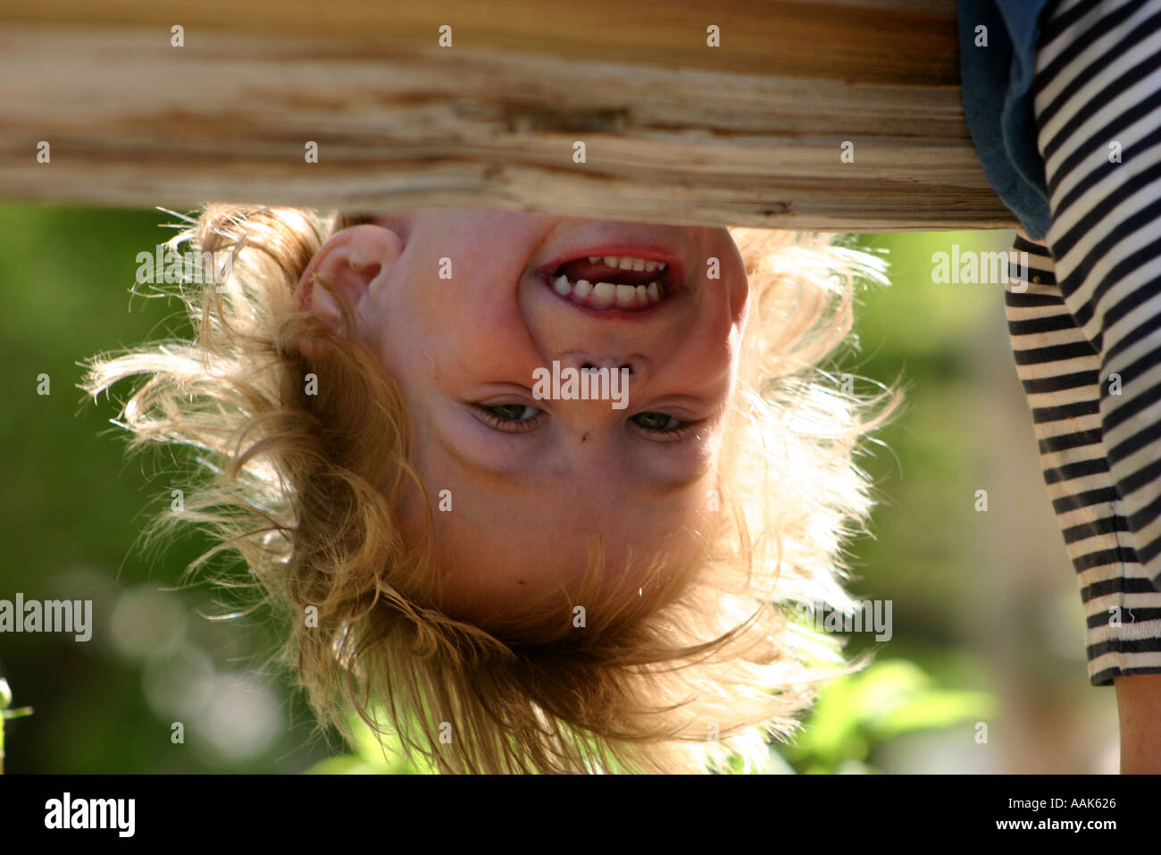 child smiling upside down Stock Photo - Alamy