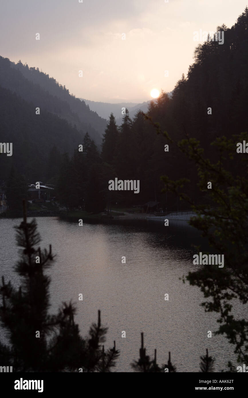 Fondo, Italy: Lake Smeraldo nestled among woodlands in the Dolomite ...