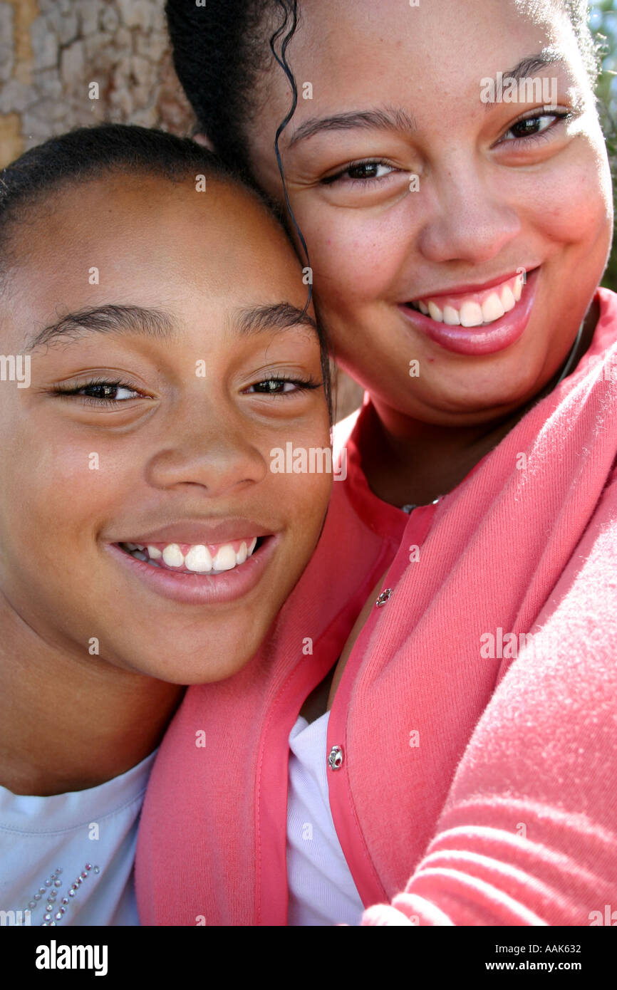portrait of sisters smiling Stock Photo - Alamy