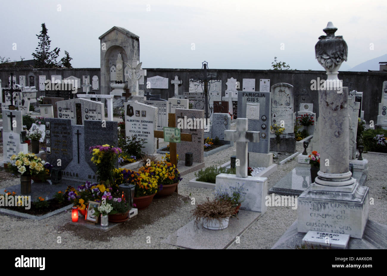 Sarnonico, Trentino, Italy: A church cemetery with headstones and a ...