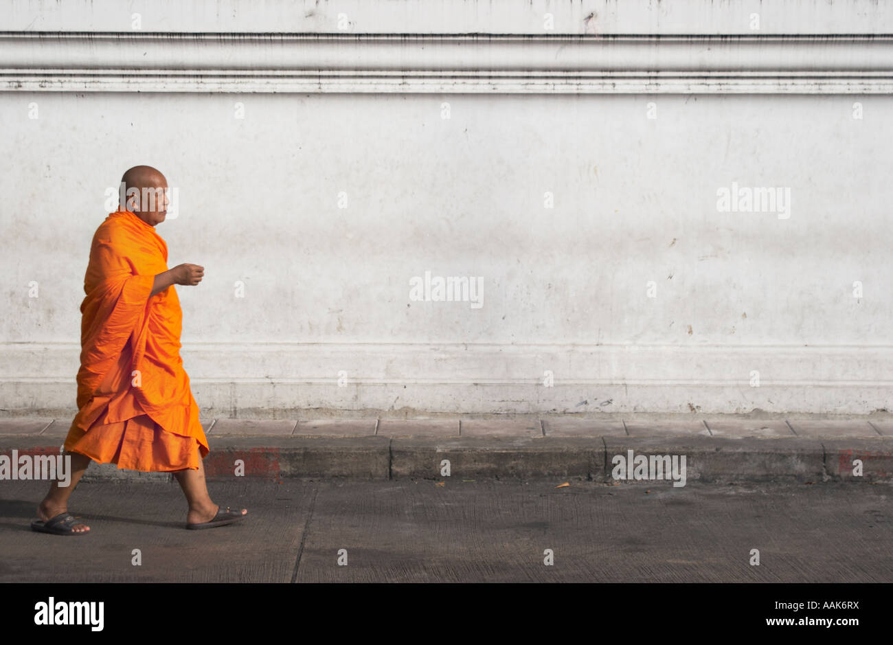 Monk Walking Along Road Stock Photo - Alamy
