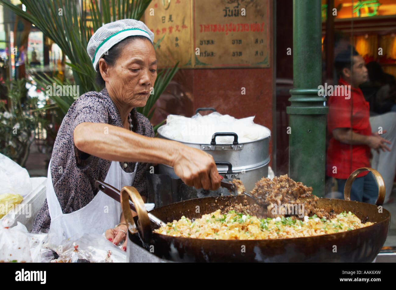 Woman Cooking In Wok By Roadside Stock Photo - Alamy