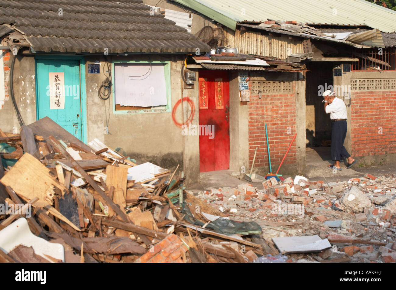 Old Man Entering House Surrounded By Rubble Stock Photo - Alamy