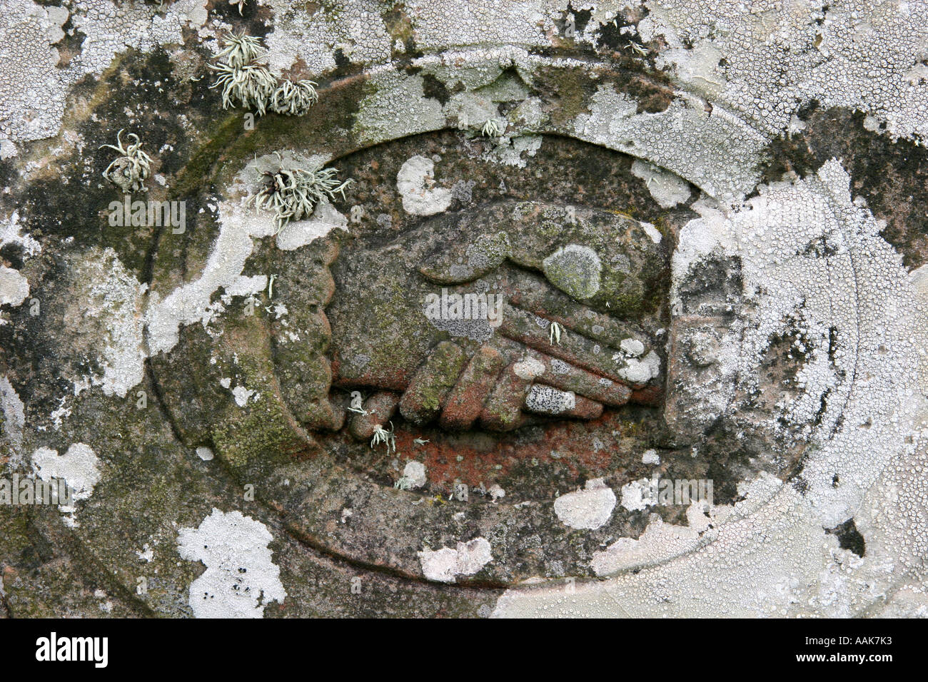 Hands on headstone Stock Photo - Alamy