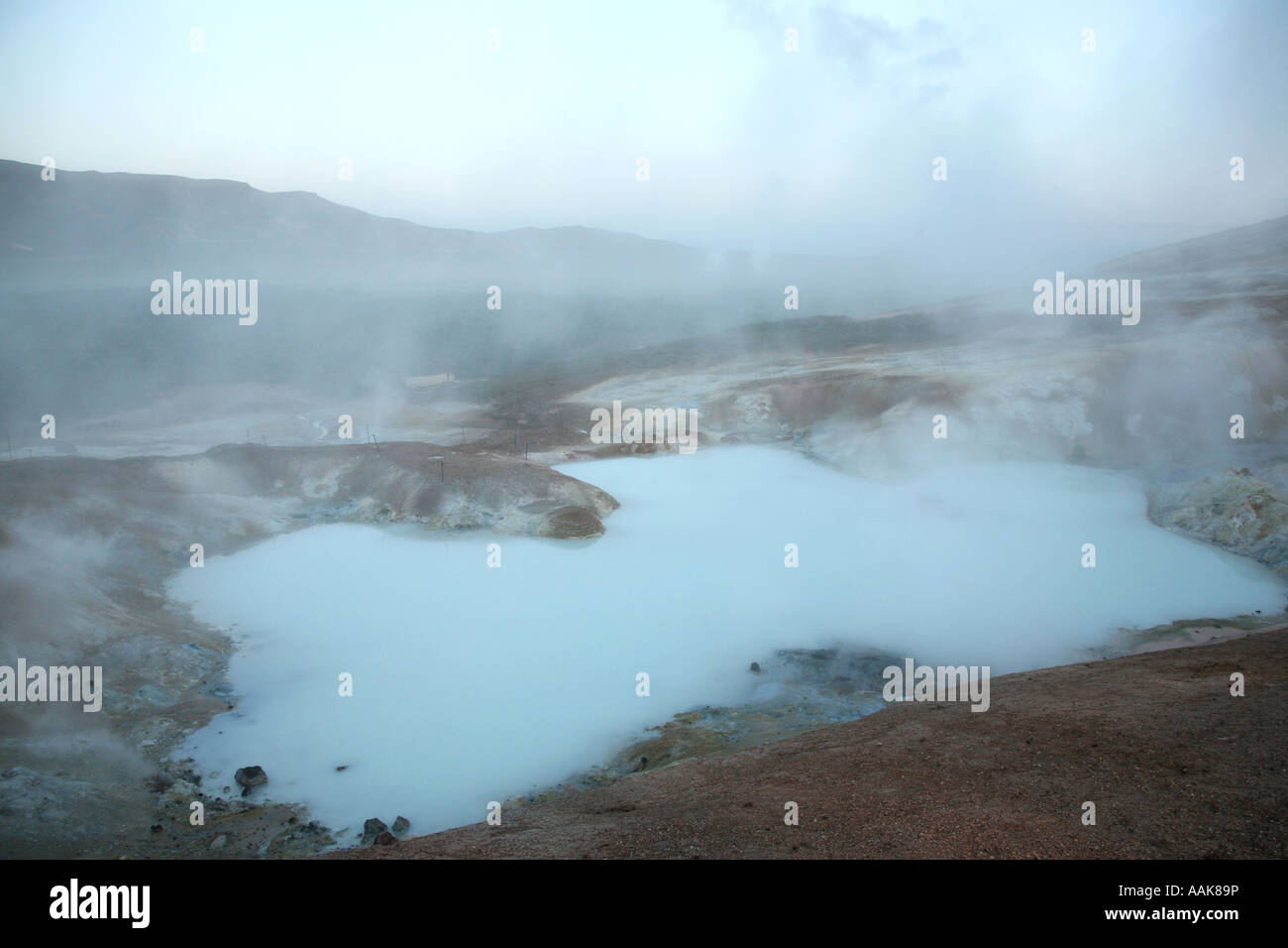 Steaming volcanic pool at dusk Krafla Iceland Stock Photo - Alamy
