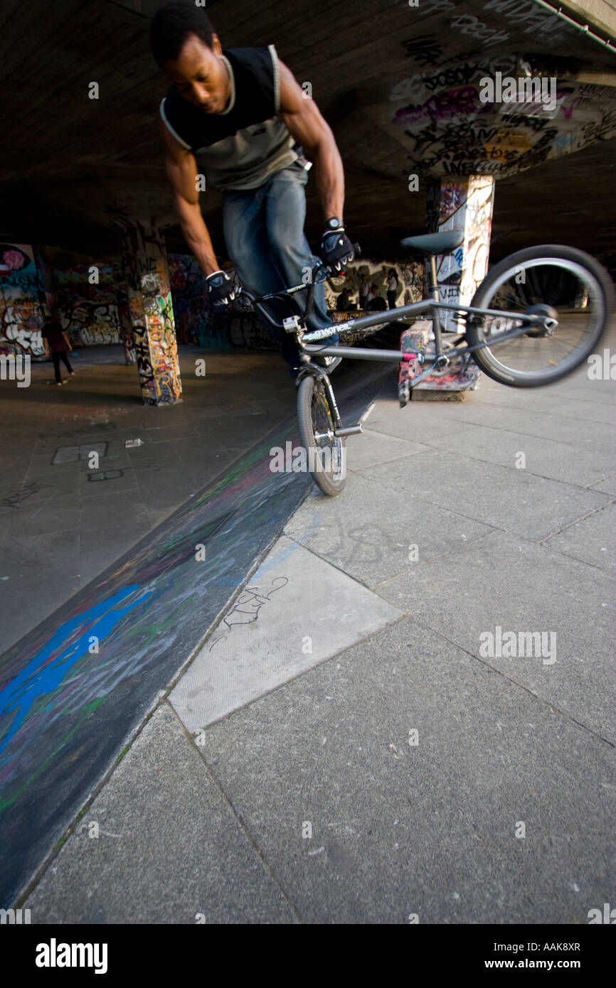 BMX rider performing a stunt on his bicycle Stock Photo - Alamy