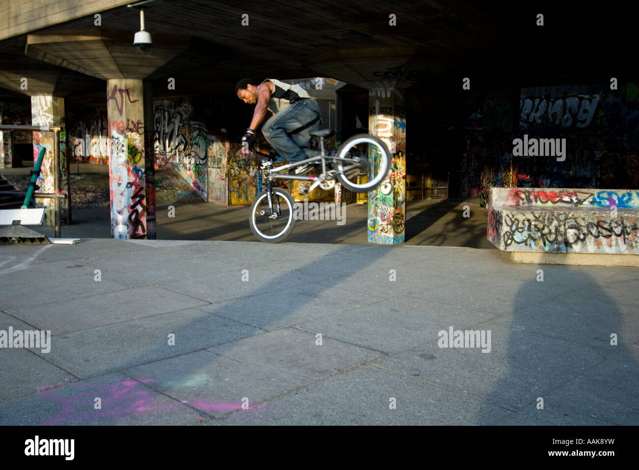 BMX rider performing a stunt on his bicycle Stock Photo - Alamy