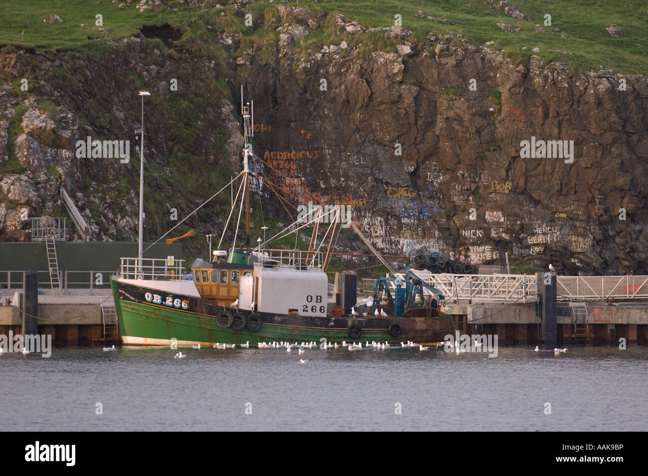 Scottish inshore trawler tied up at Canna pier Scotland June 2007 Stock ...