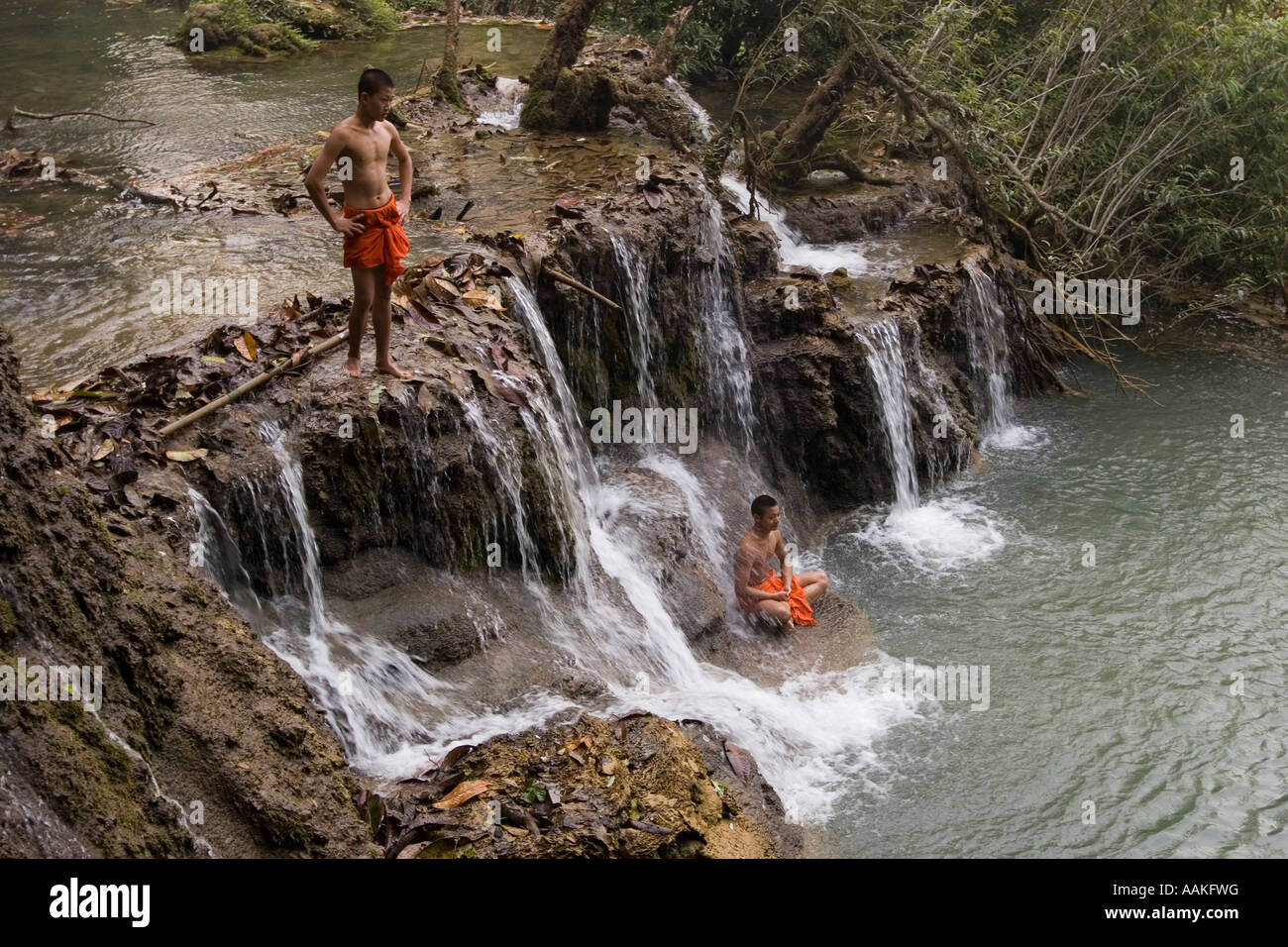 Novice monks Kuang Xi waterfall near Luang Prabang Laos Stock Photo - Alamy