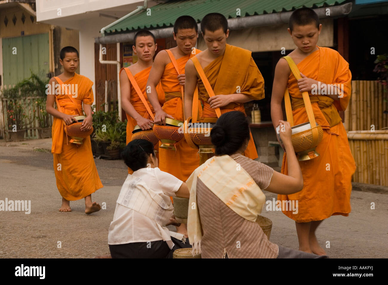 Procession of monks receiving alms Luang Prabang Laos Stock Photo - Alamy
