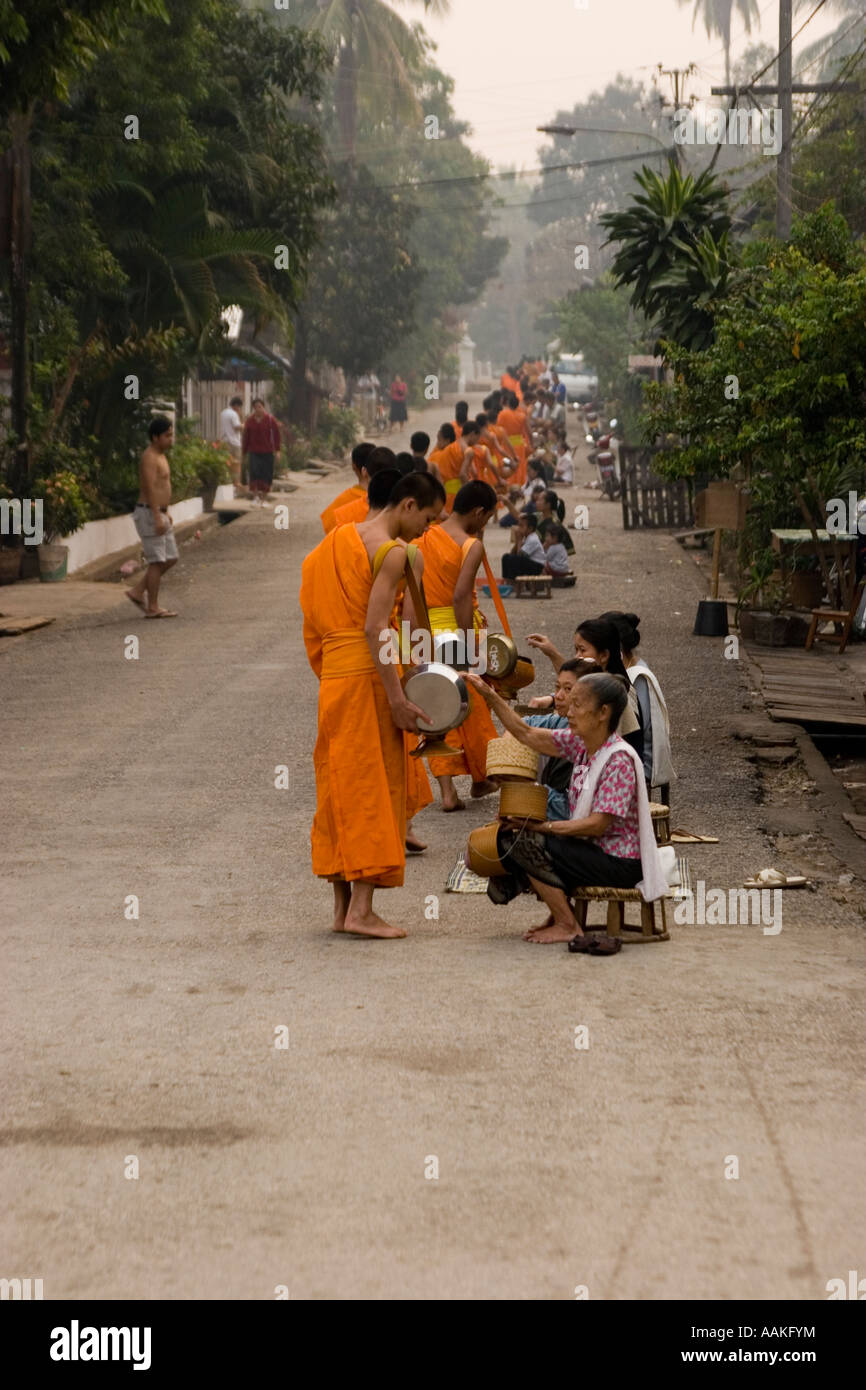 Procession of monks receiving alms Luang Prabang Laos Stock Photo - Alamy
