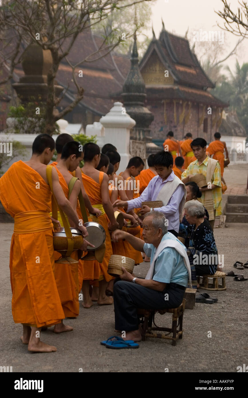 Procession of monks receiving alms Luang Prabang Laos Stock Photo - Alamy