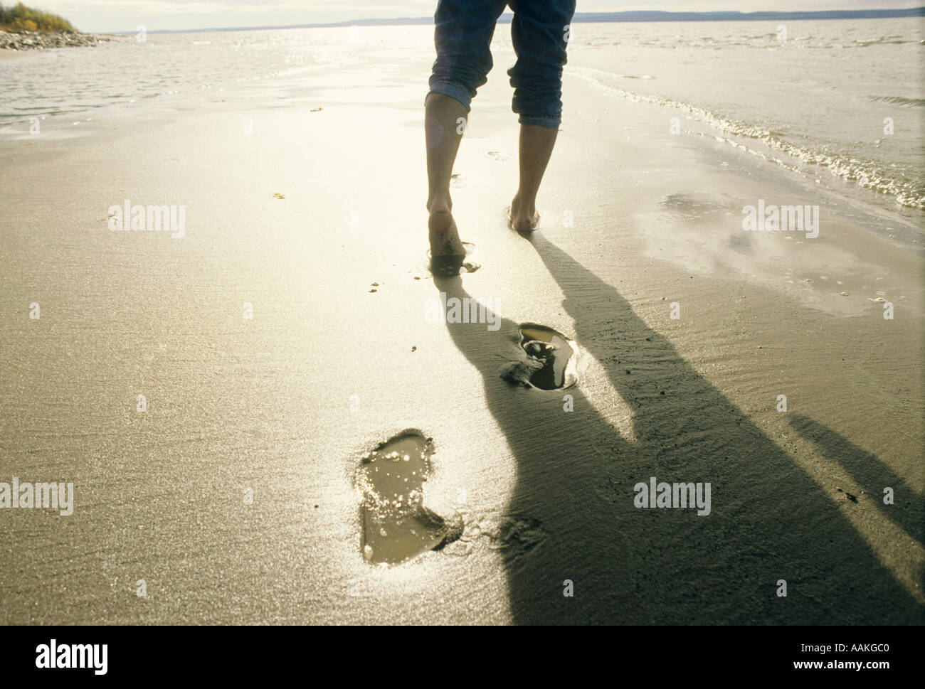 Person walking on sandbar Stock Photo - Alamy