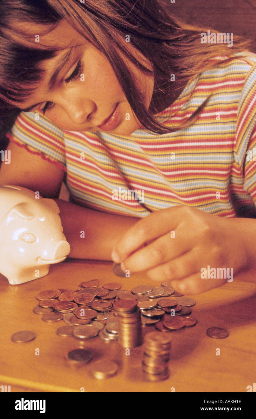 Young girl counting money Stock Photo - Alamy