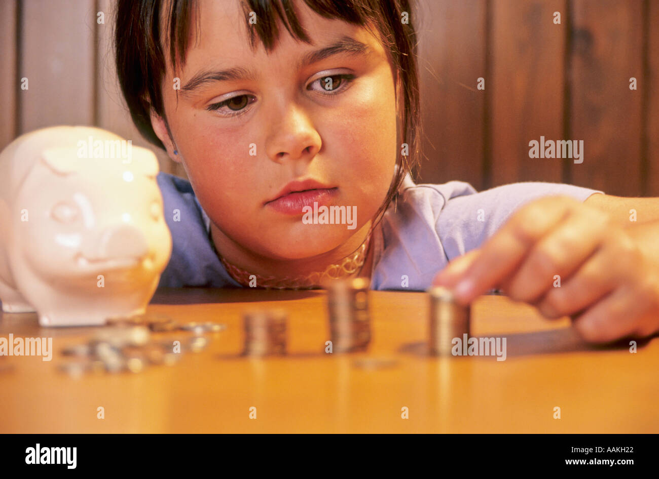 Young girl counting money Stock Photo - Alamy