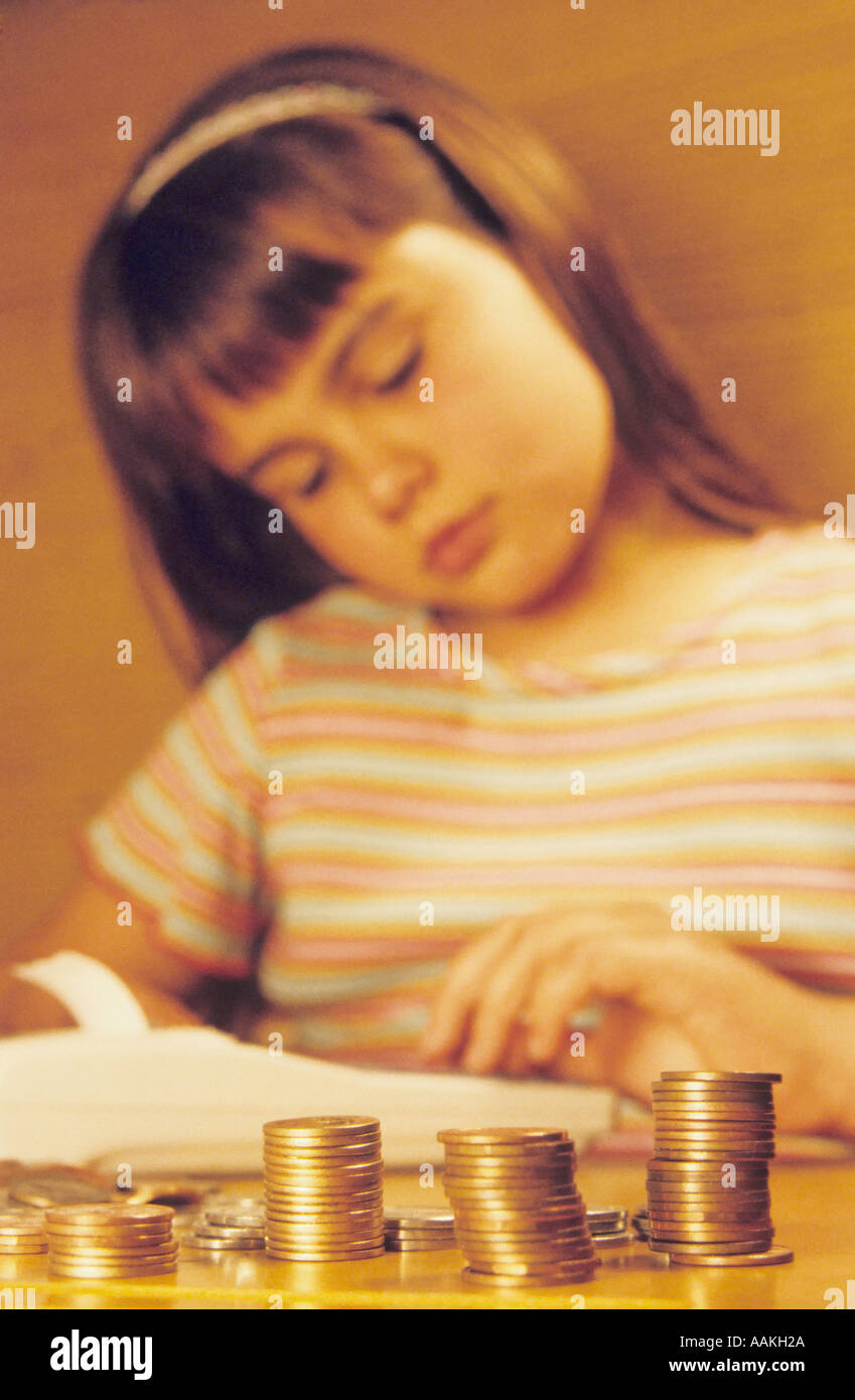 Young girl counting money Stock Photo - Alamy