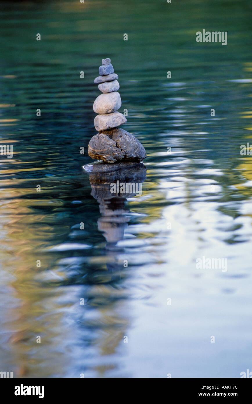 Rocks stacked in water Stock Photo - Alamy